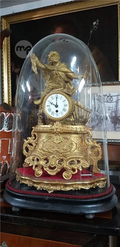 An Antique French gilded Clock under original glass dome. better known ...