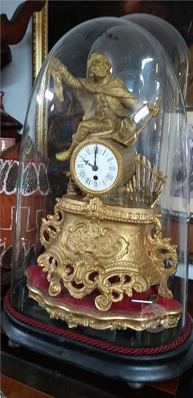 An Antique French gilded Clock under original glass dome. better known ...