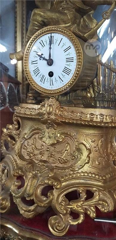 An Antique French gilded Clock under original glass dome. better known ...