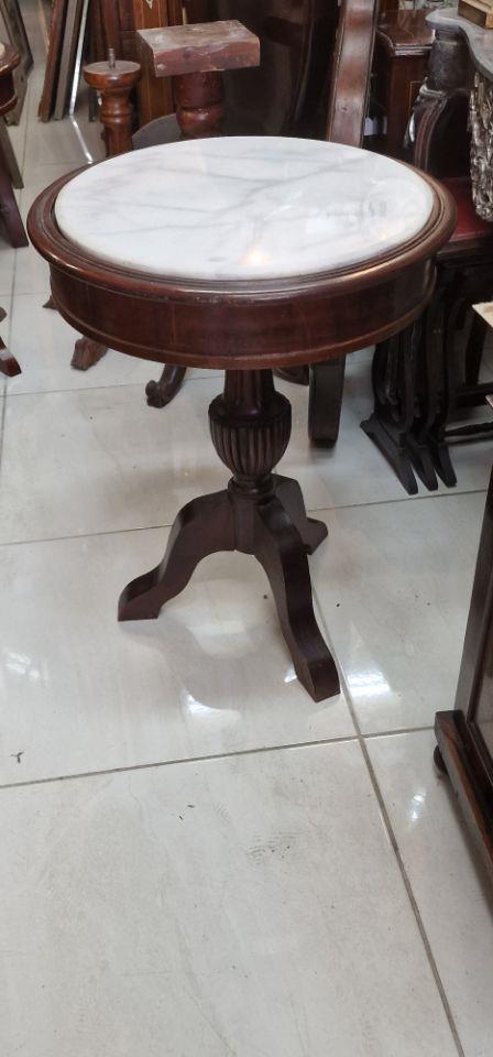 An elegant round table with white marble top. Measures 59 X 77 CMS high. | Maltapark