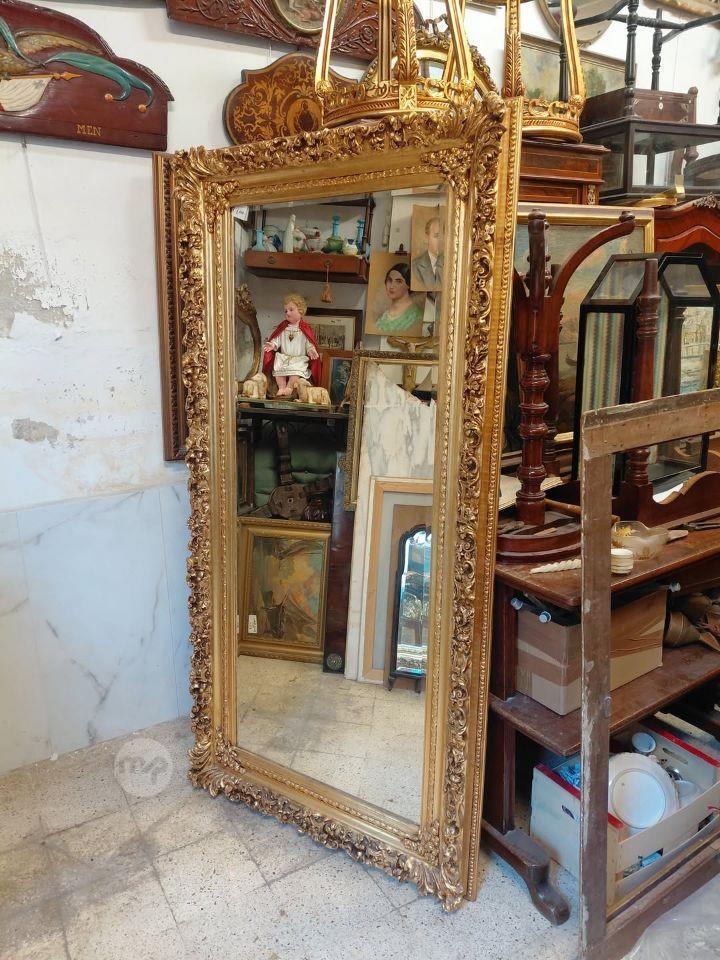 An Elegant Large gilded mirror Measures 200 x 100 cms 99456526An ...